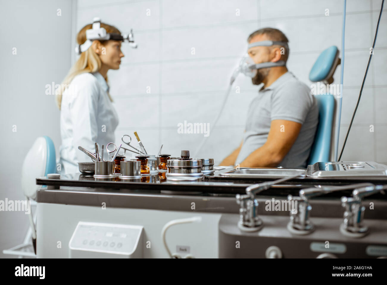 Adult man during a medical breathing treatment with respiratory mask ...