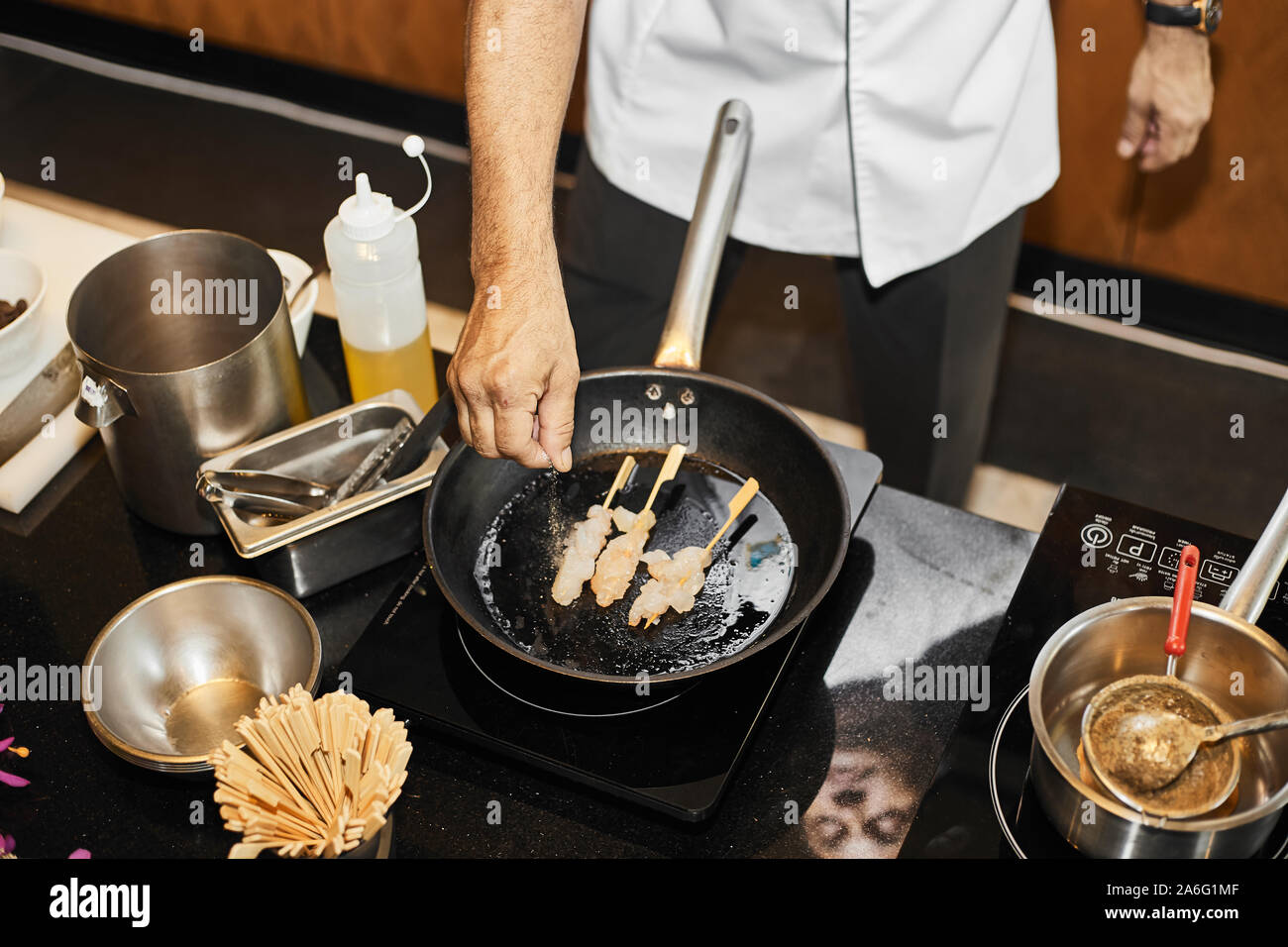 Chef cooking in a kitchen Stock Photo - Alamy