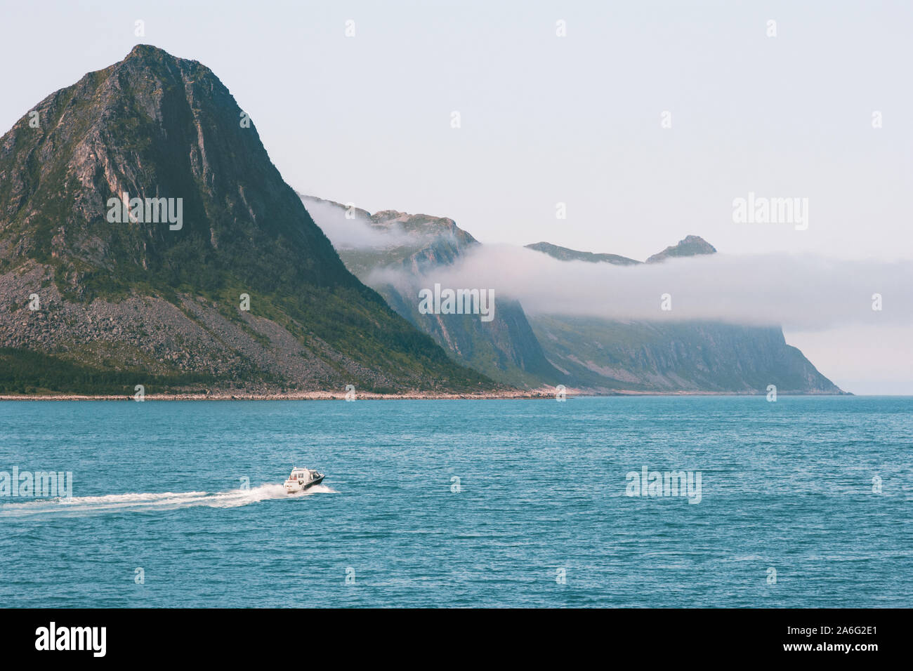 Husoy island in Norway mountains and boat in sea landscape Travel ...