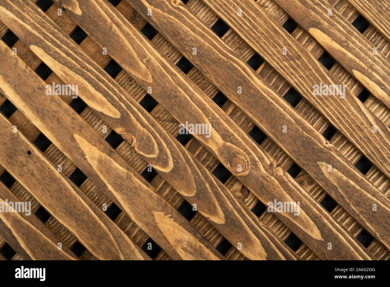 Texture of the wooden lattice. Natural wooden diagonal lattice. Close ...