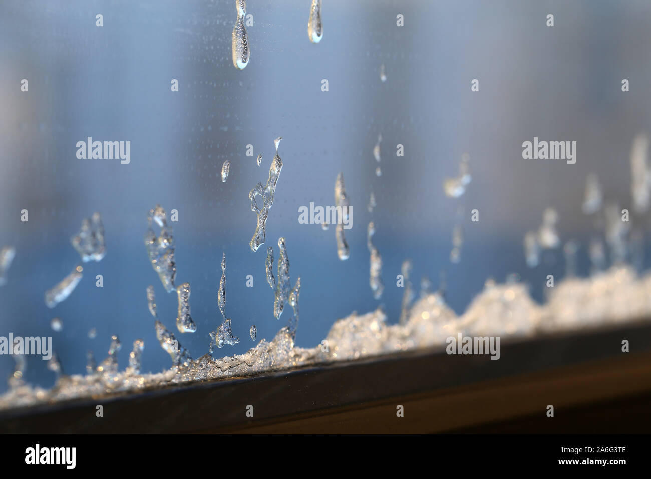 Balcony window with frozen water drops on it. Photographed during a ...