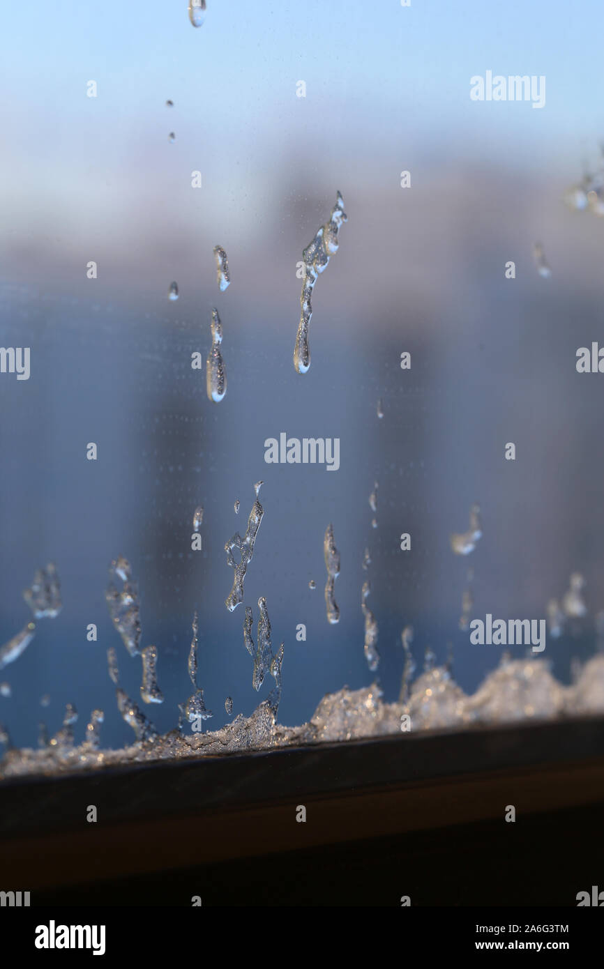 Balcony window with frozen water drops on it. Photographed during a ...