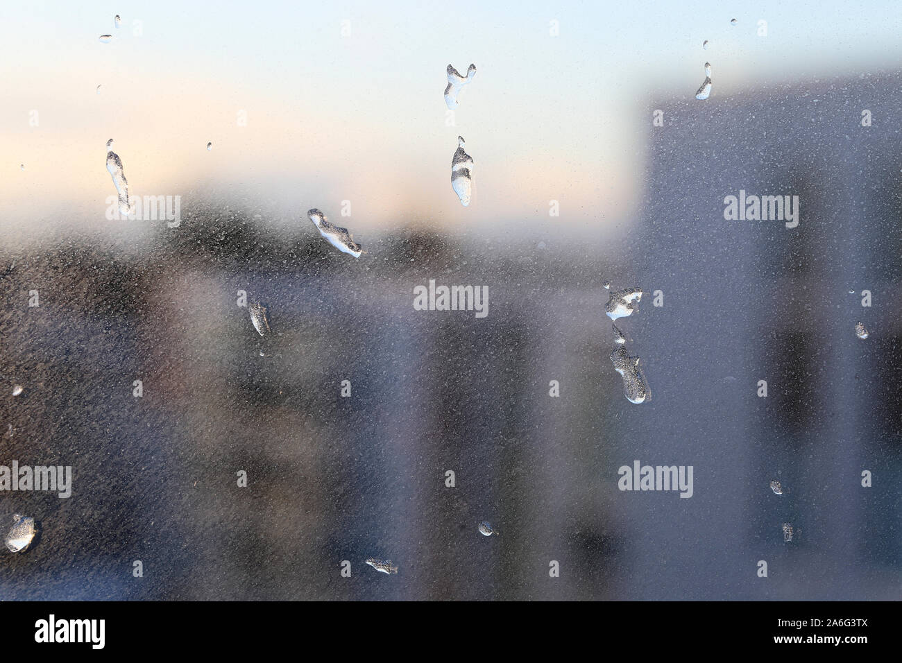 Balcony window with frozen water drops on it. Photographed during a ...