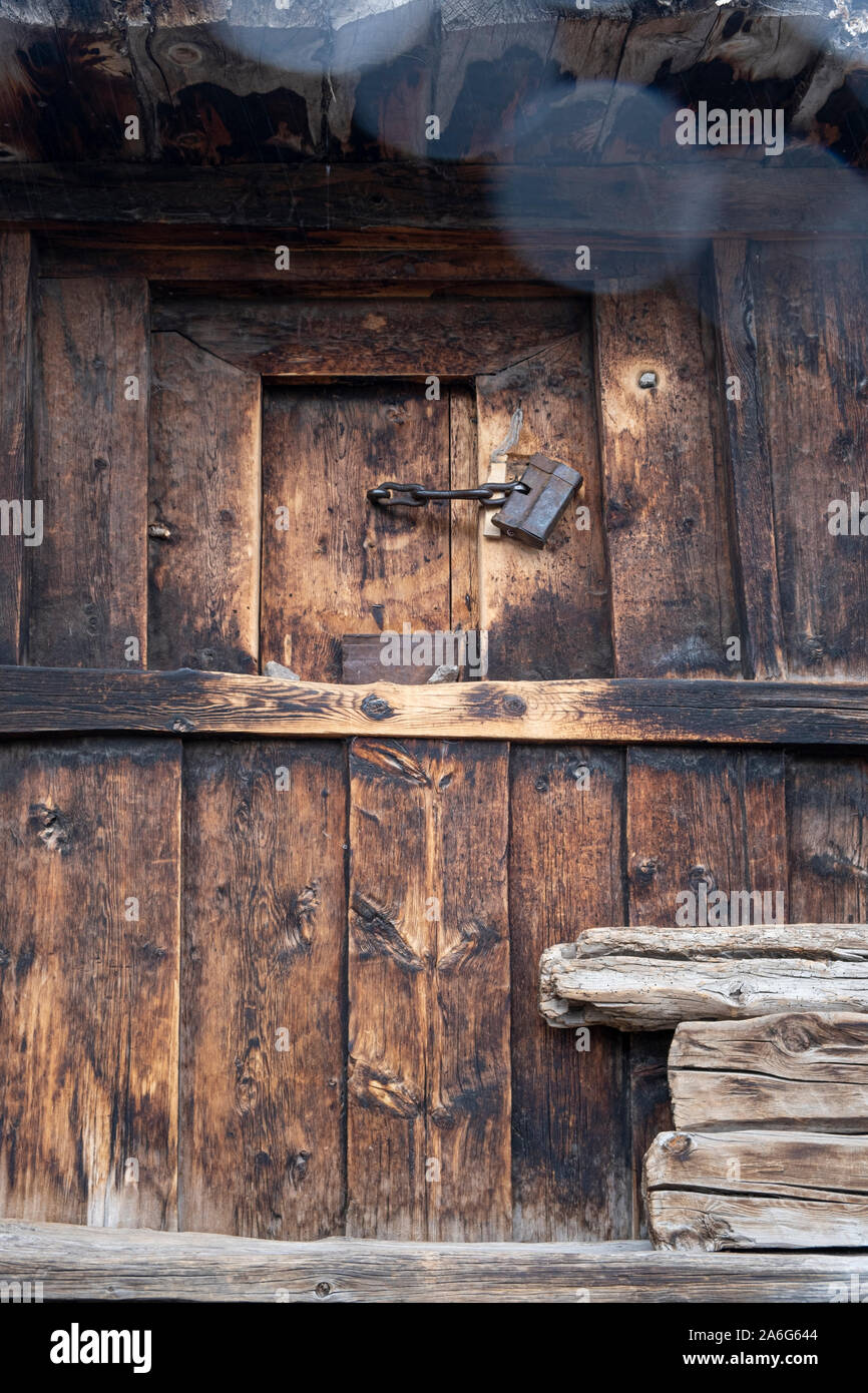 Close up of a window with a padlock on a wooden cabin. Chitkul ...
