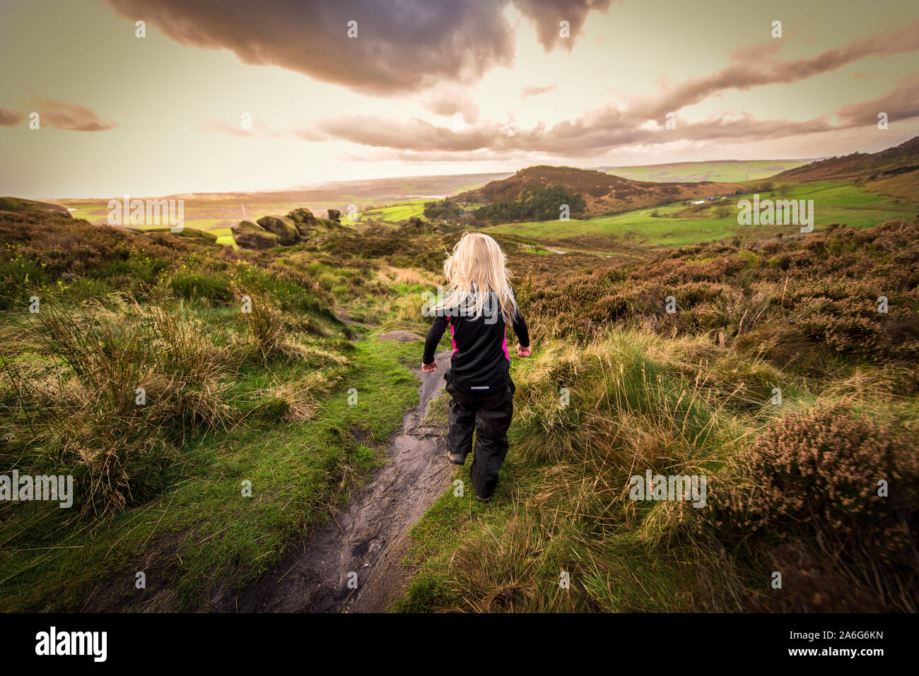 A pretty young girl, walking, hiking and mountain climbing in the ...