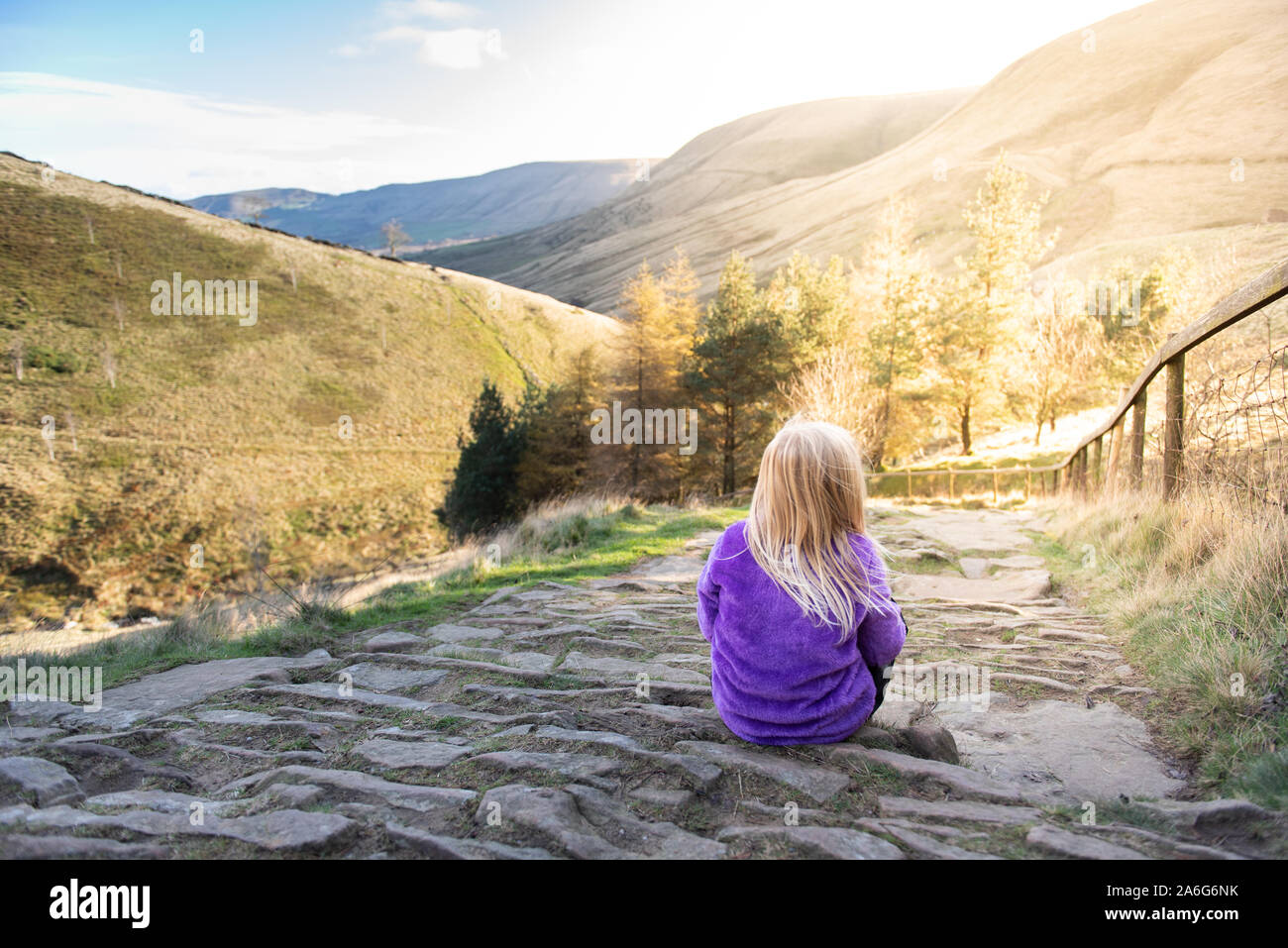 A pretty young girl, walking, hiking and mountain climbing in the ...