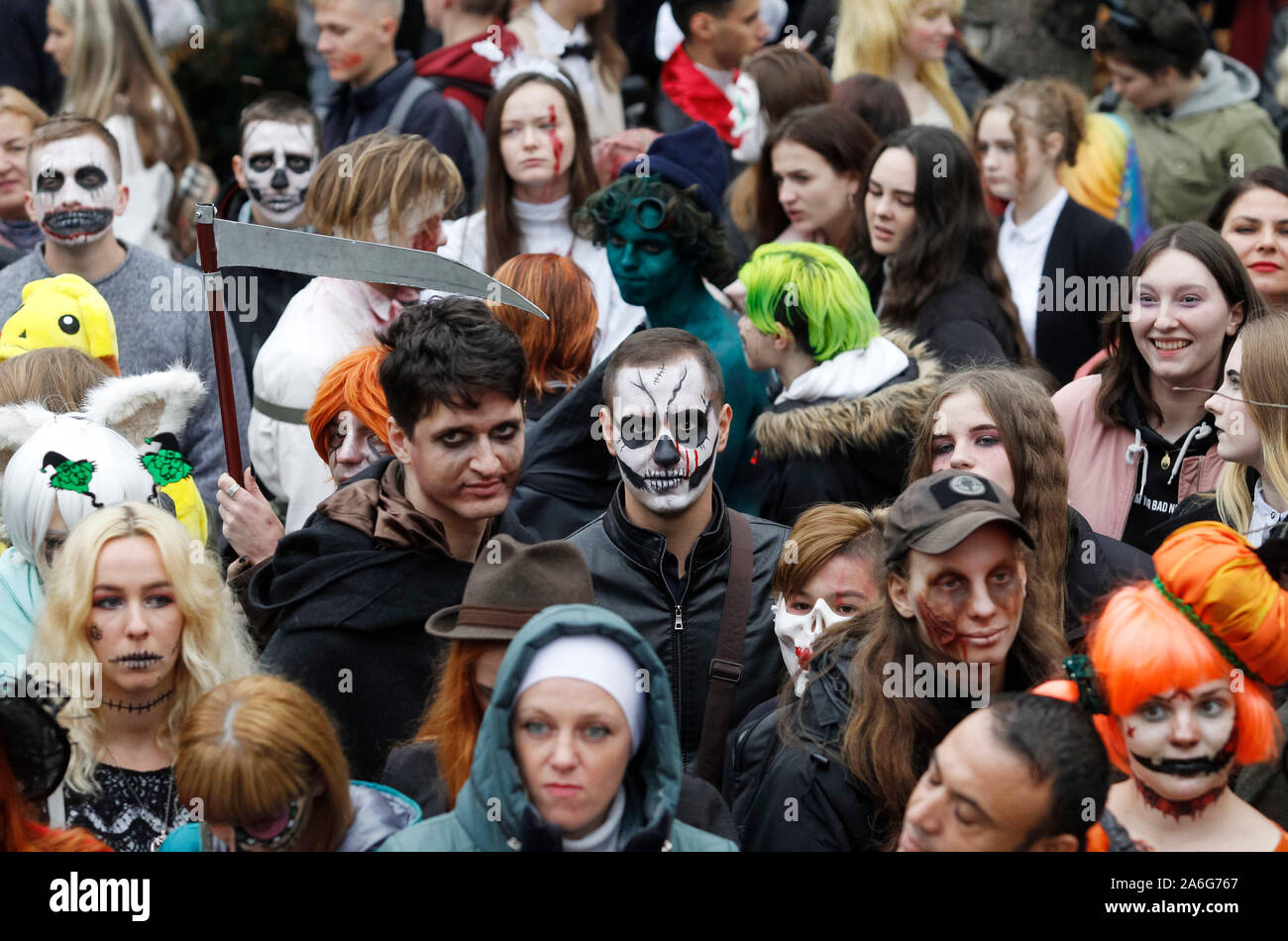 Participants wearing make-up and zombie costumes attend the Halloween ...