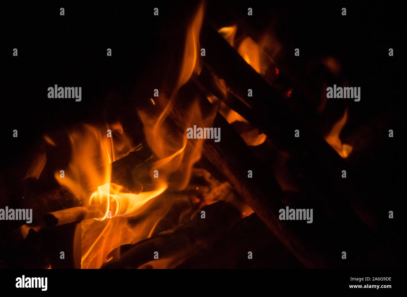 Elements: fire. Bright flames of a bonfire, fire wrapping the sticks in ...