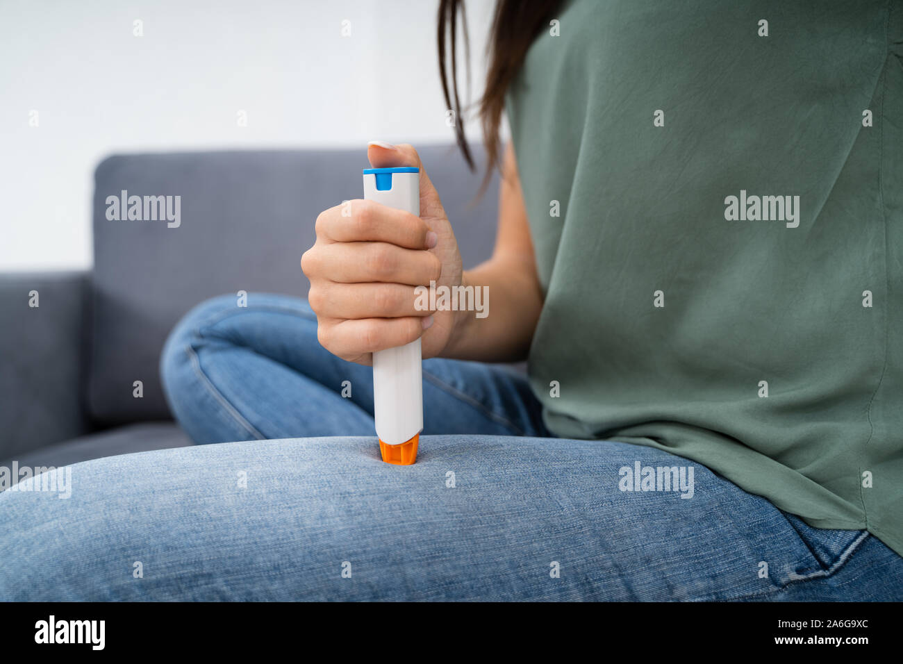 Woman Injecting Epinephrine Using Auto-injector Syringe As An Emergency ...