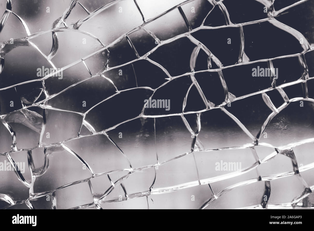 A cracked and broken glass window Stock Photo - Alamy