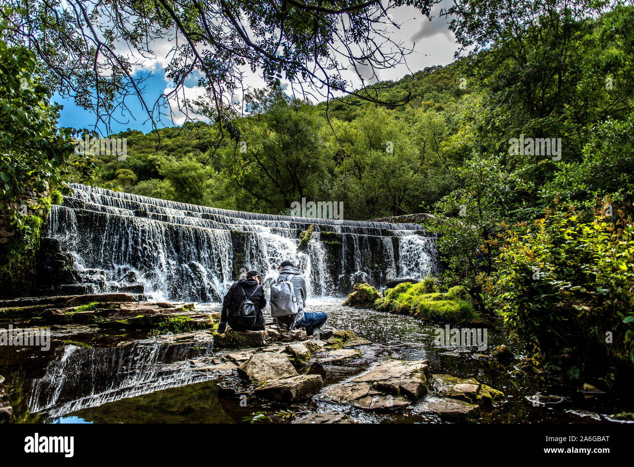Landscape Photographers & tourists taking pictures of a waterfall in ...