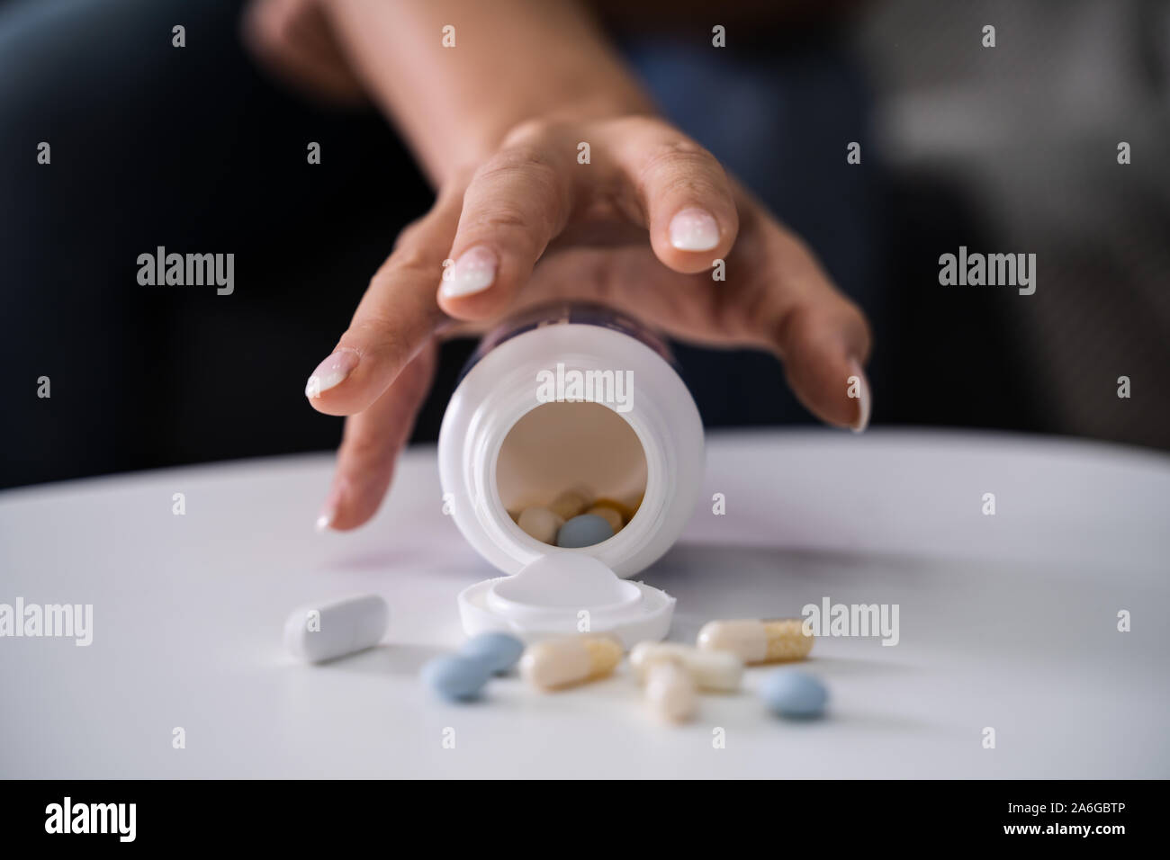 Drug Addicted Woman Reaching For Medication At Home Stock Photo - Alamy