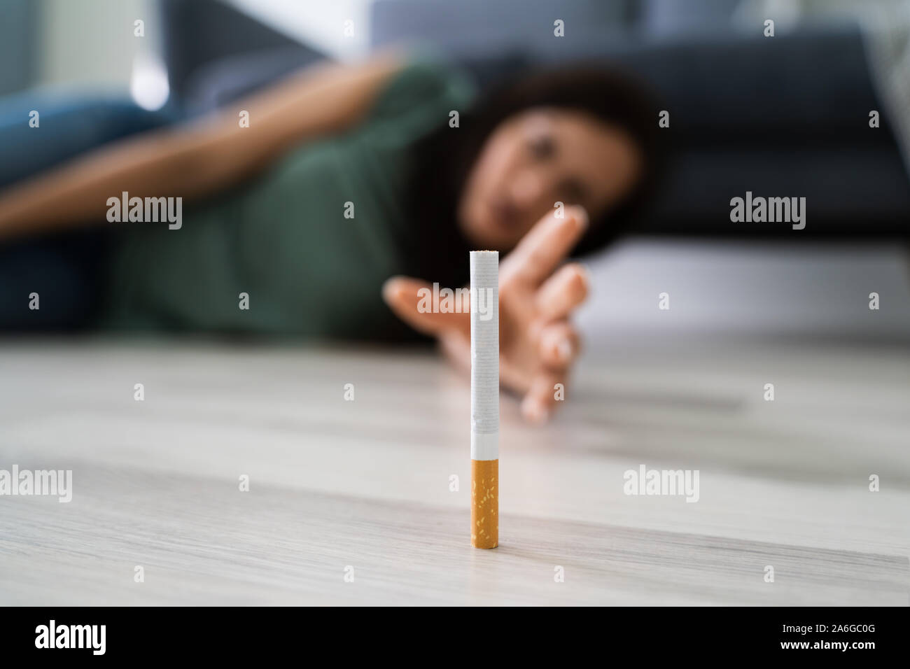 Smoking Addicted Woman Reaching For Cigarette At Home Stock Photo - Alamy