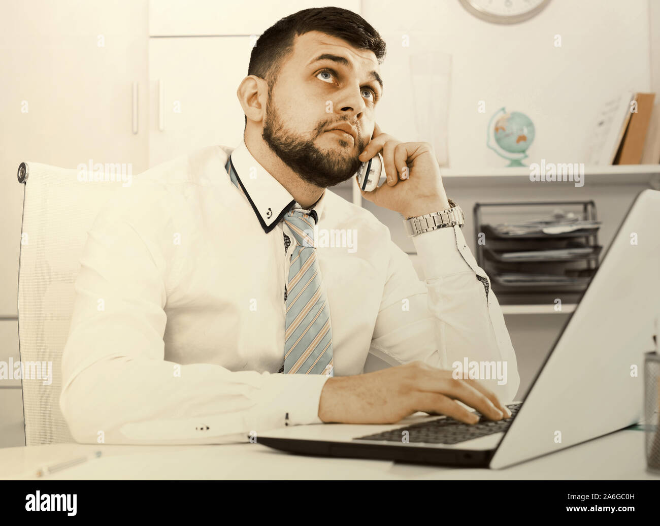 Smiling man worker working effectively on project in office Stock Photo ...
