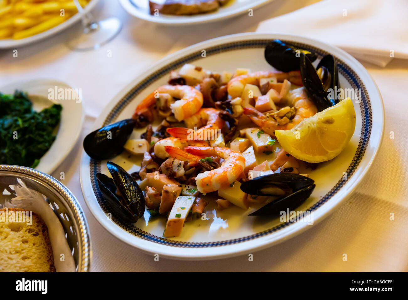 Typical Italian dish Frittura di mare, fried assorted seafoods served ...