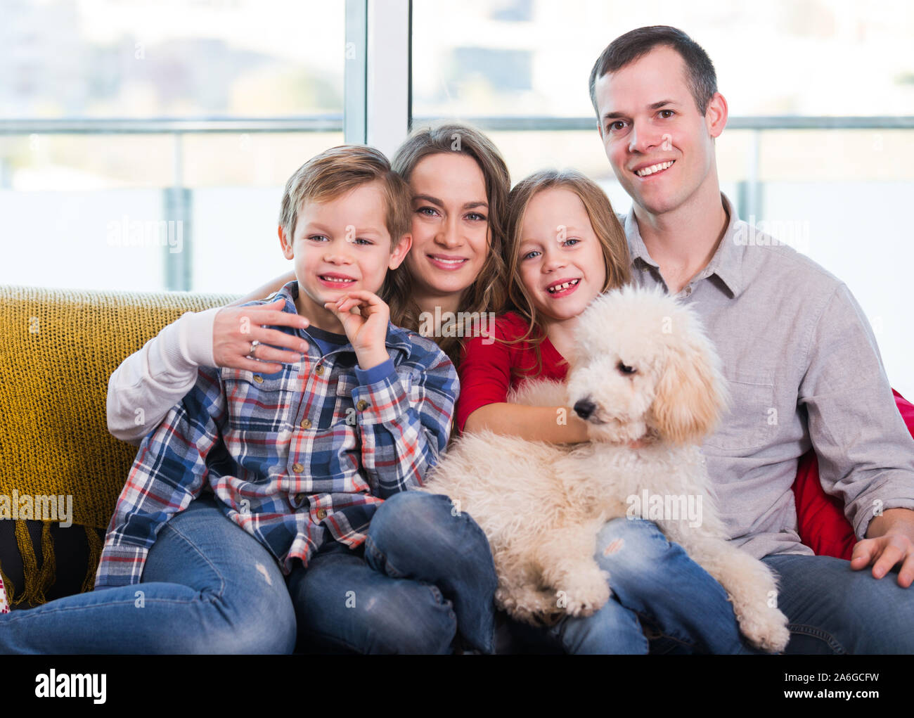 Calm family enjoying evening together at home Stock Photo - Alamy