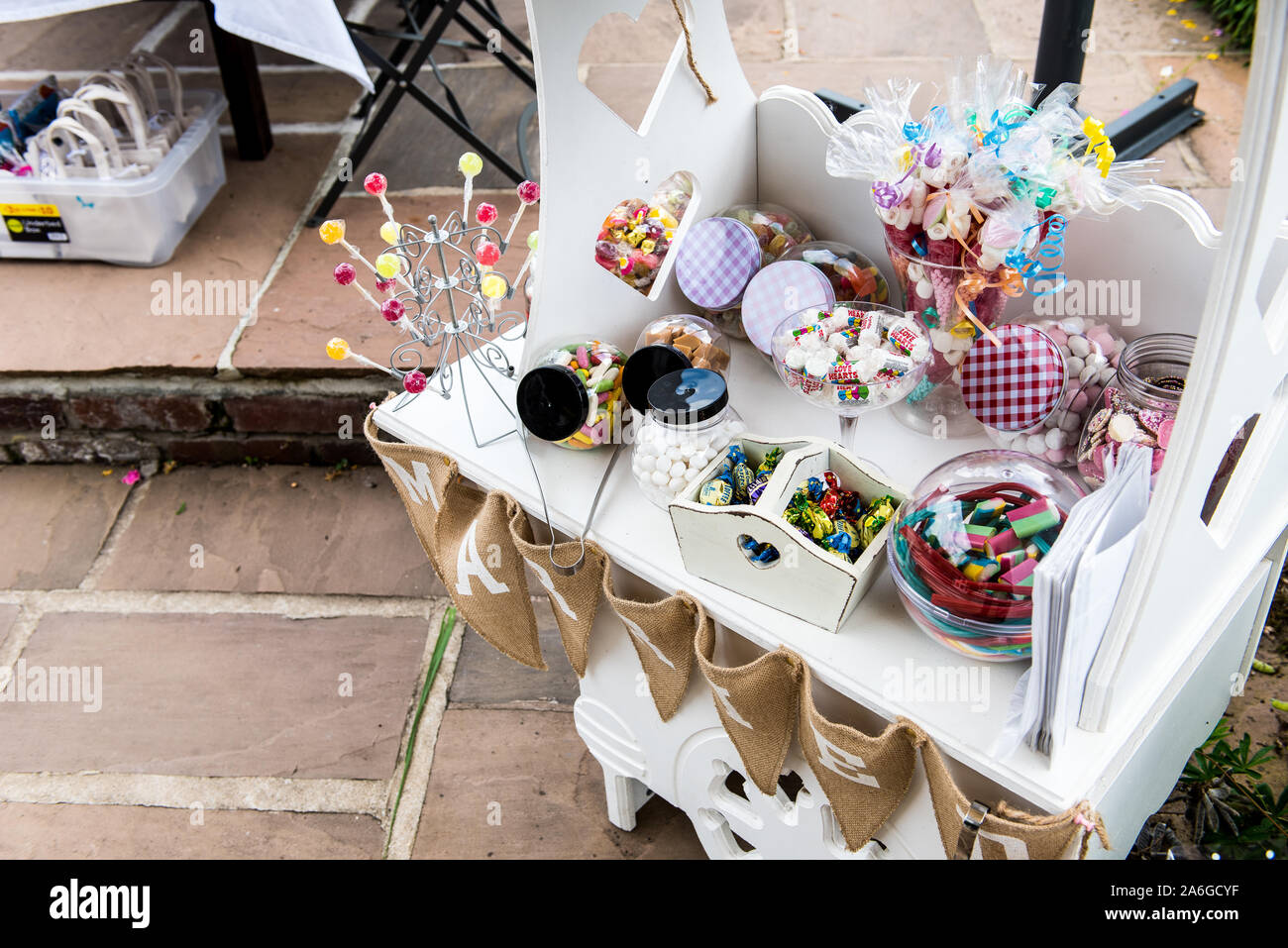 A beautiful wedding sweet cart with an variety of sweets ready for ...