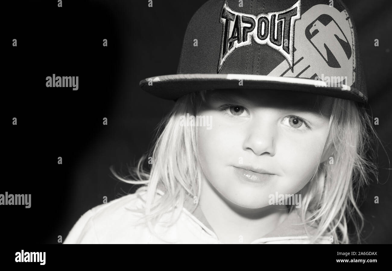 A little girl wearing a tappet cap posing for a studio picture Stock ...