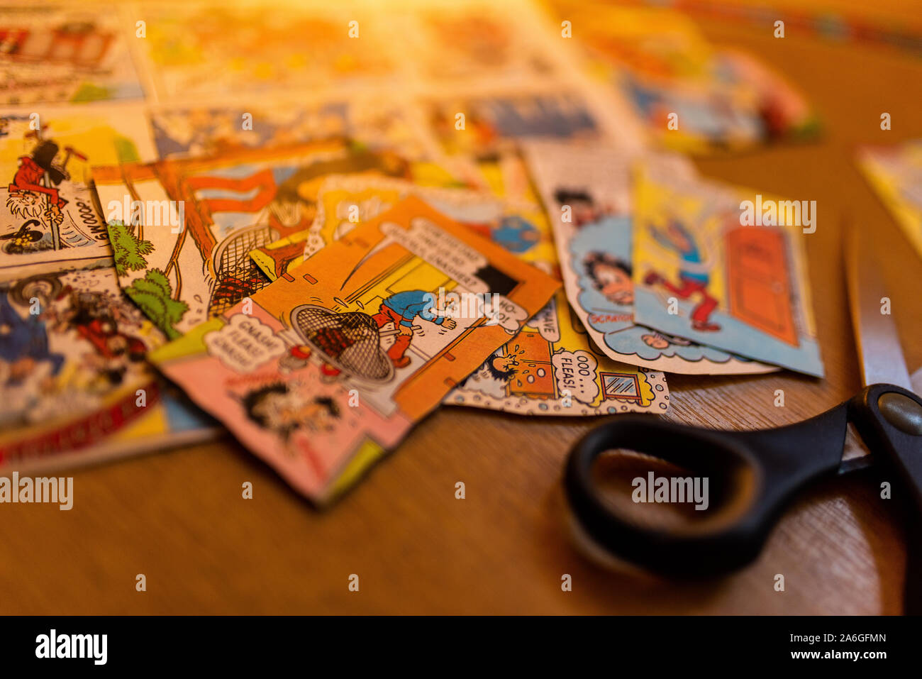 The world famous Beano comic book laid out on a desk with some scissors ...