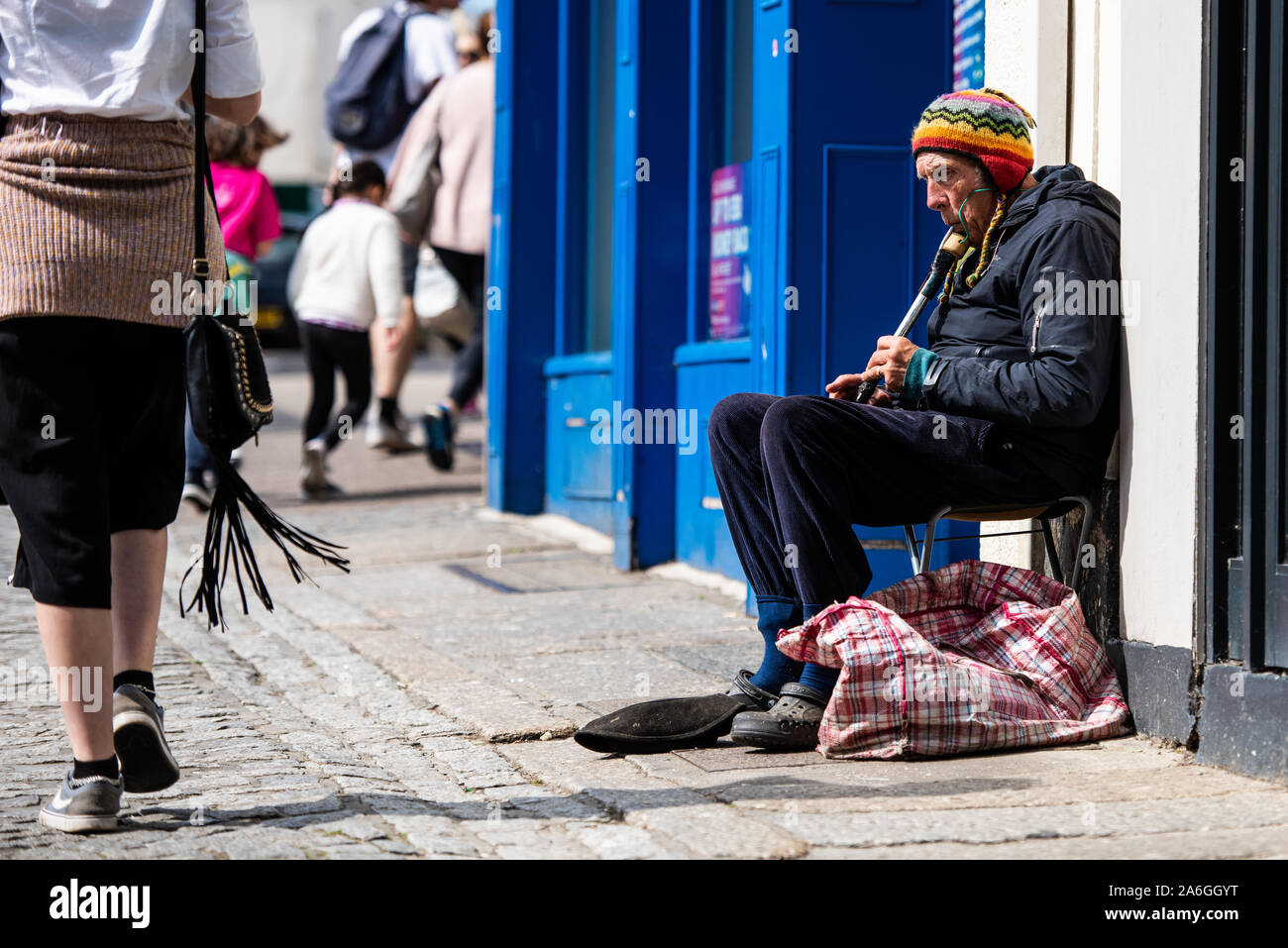 A homeless man busting for money on the high street Stock Photo - Alamy
