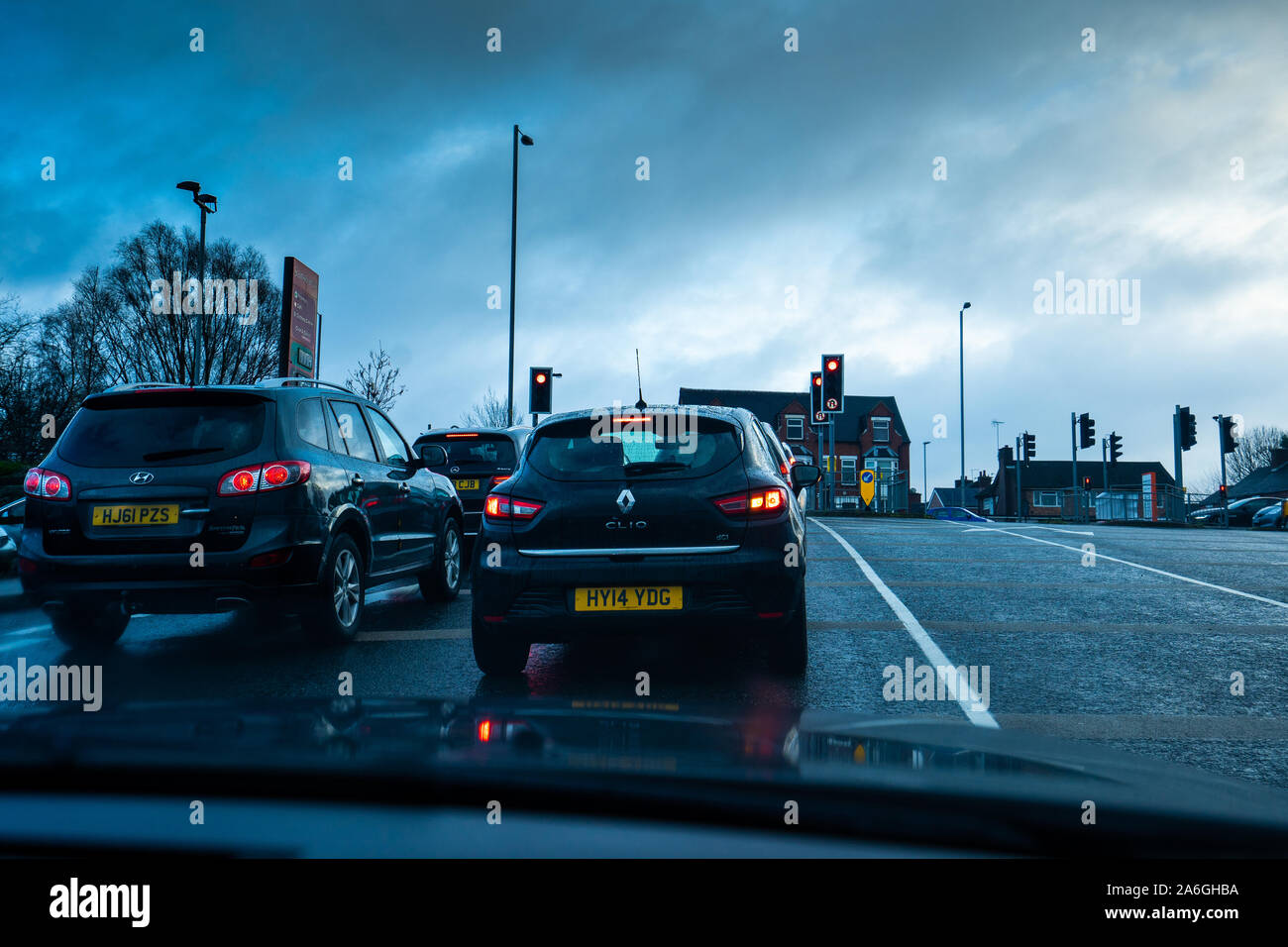 Traffic on the roads at winter time, cold conditions, city driving ...