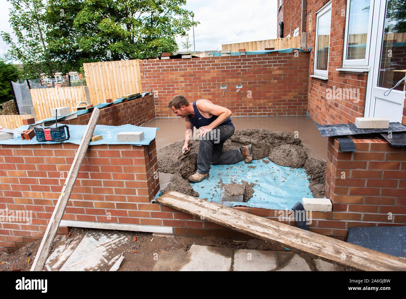Work commences on the foundations of a conservatory base, laying ...