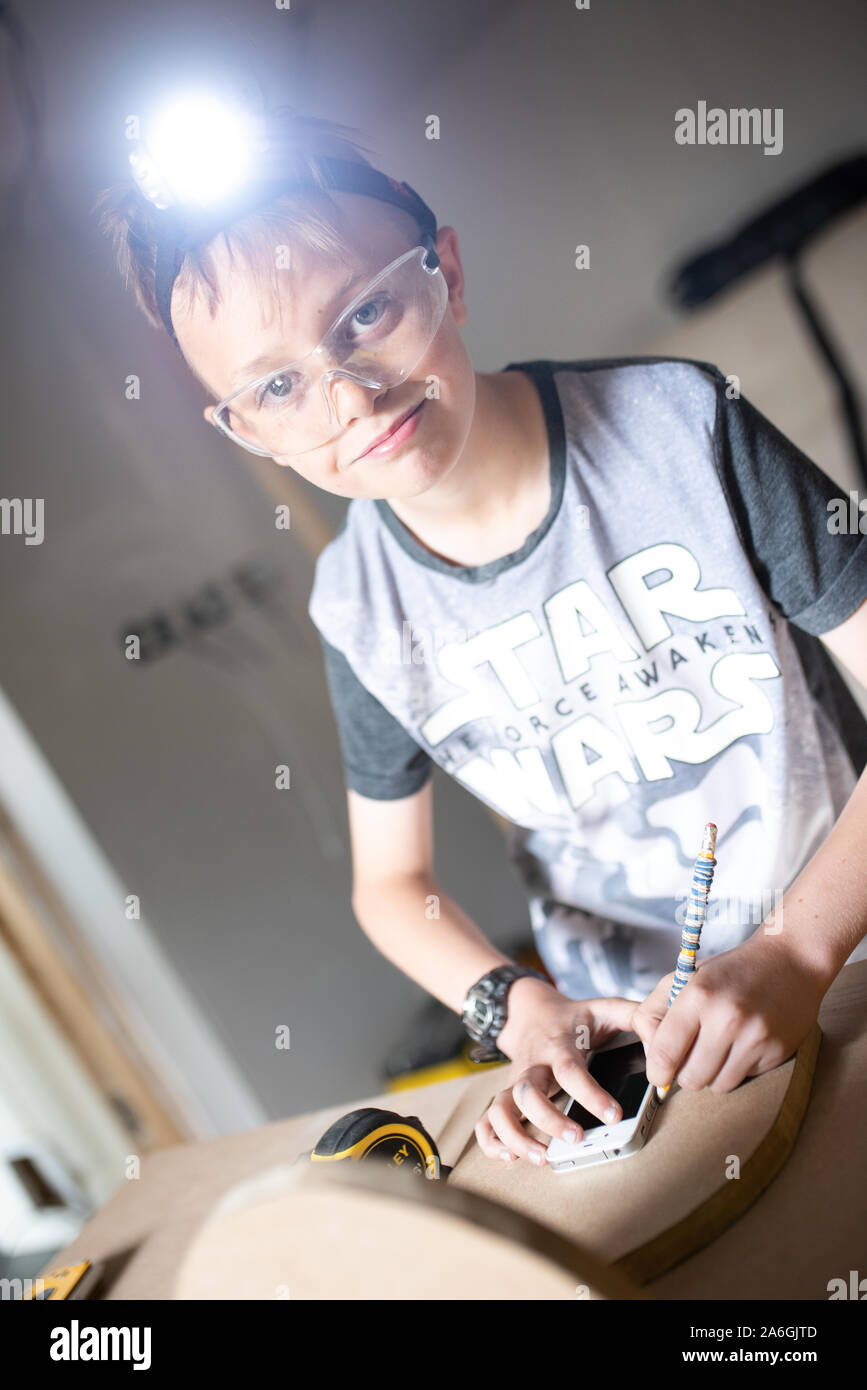 A handsome little boy with ADHD, Autism, Aspergers Syndrome, using a ...