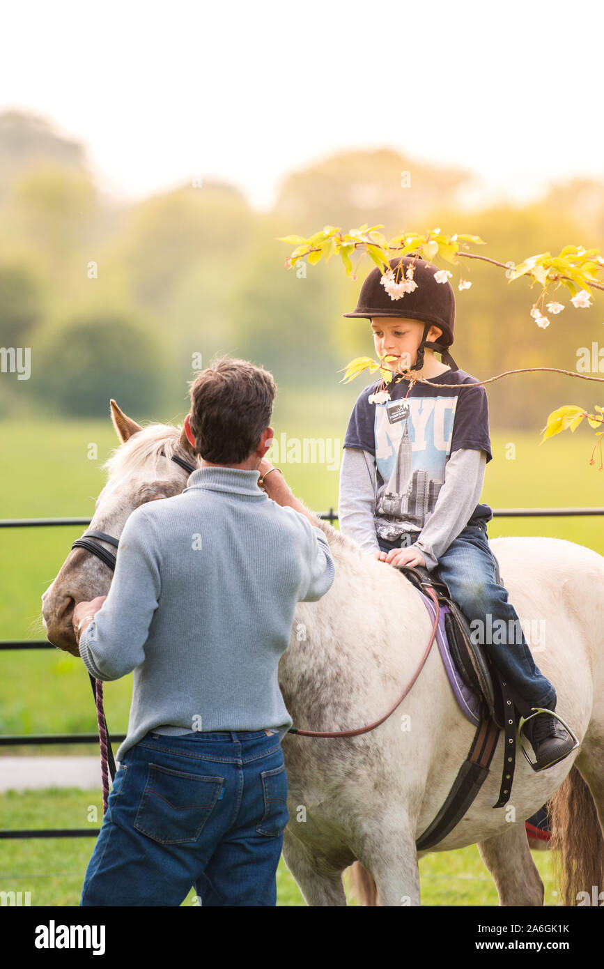 Pony lesson boy ride hi-res stock photography and images - Alamy