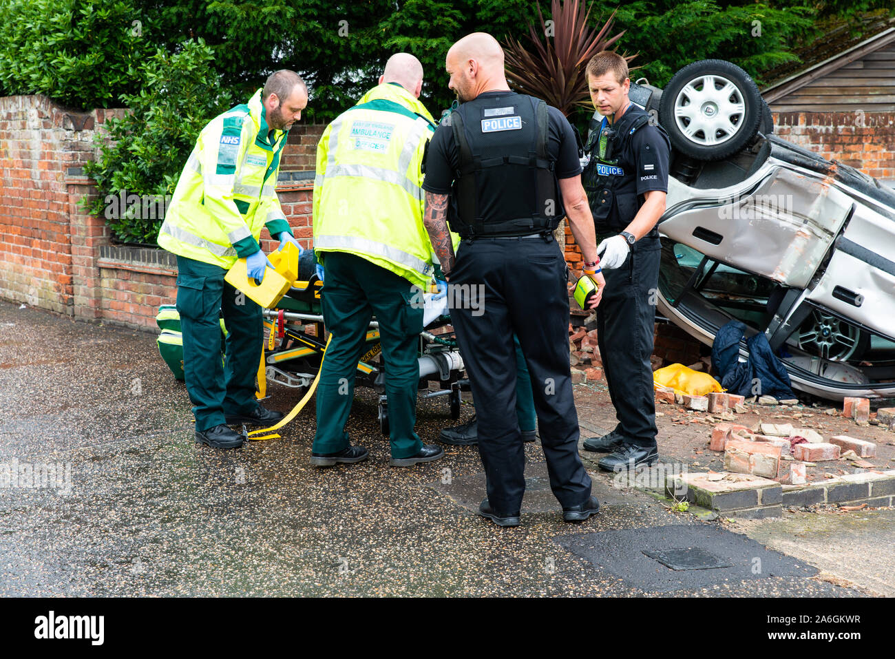 Accident emergency services over turned vehicle hi-res stock ...