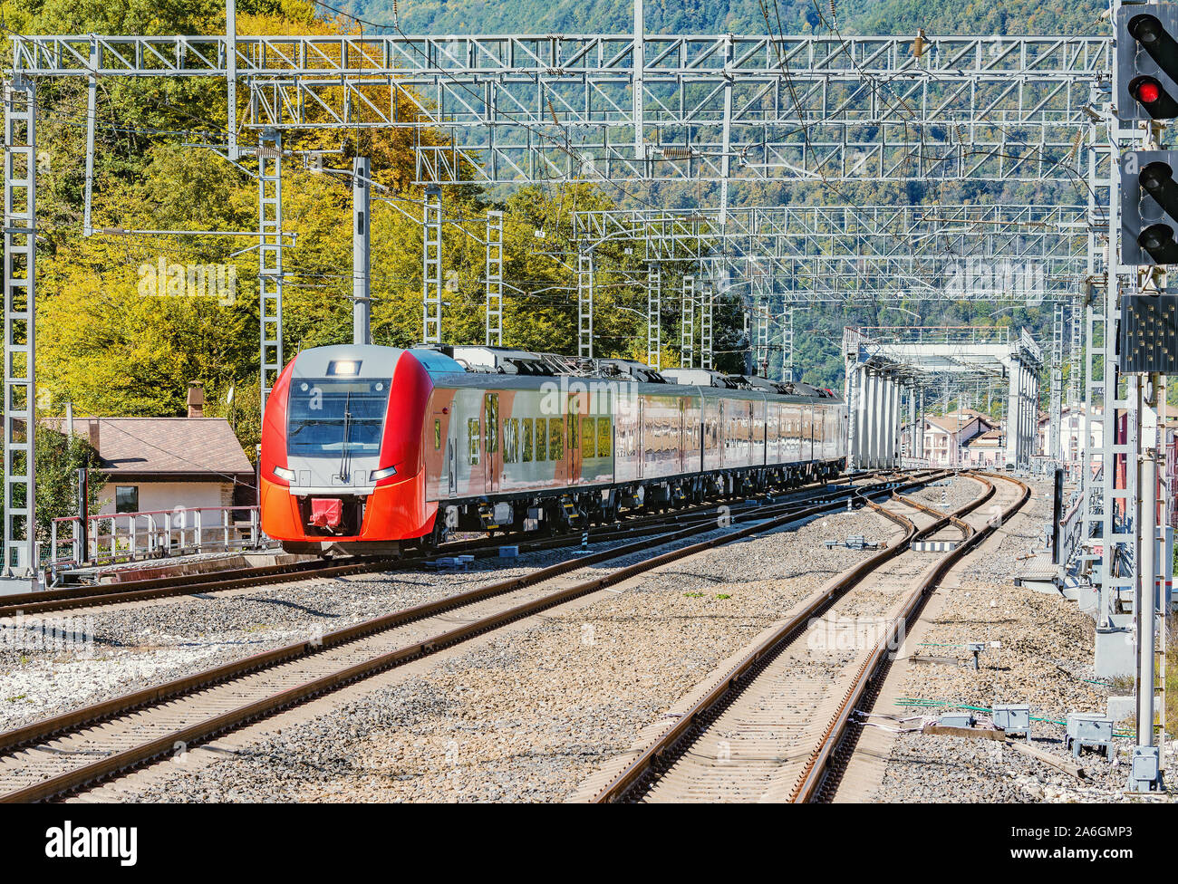 Passenger train approach to railway station. Caucasus. Russia Stock ...