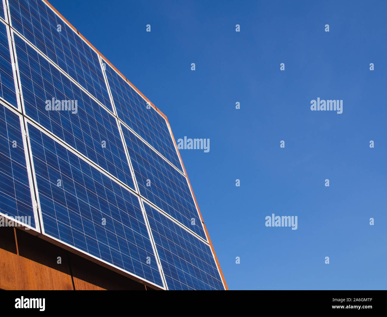 Photovoltaic solar panels on the corten steel roof of a city university ...