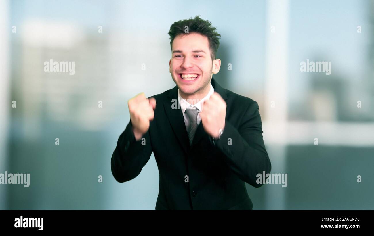 Very happy businessman expressing his joy Stock Photo - Alamy