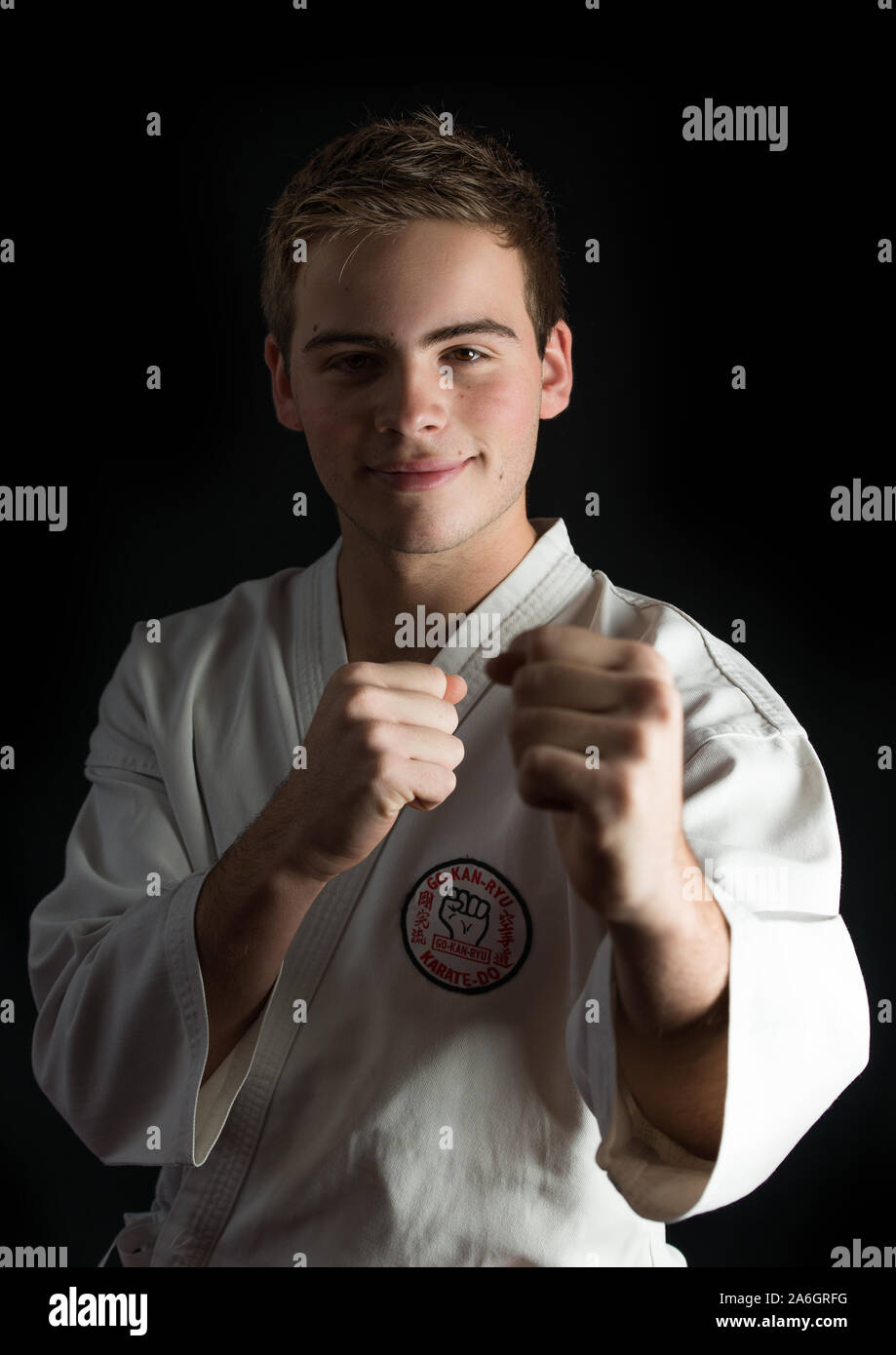 A handsome young man in his karate gi, suit Stock Photo - Alamy