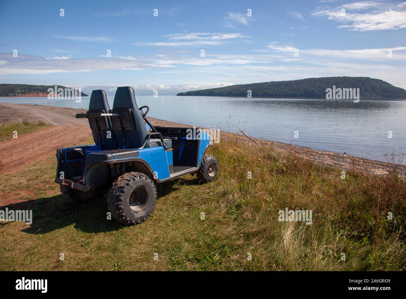 dirt road on a beach with an empty off road vehicle ready for adventure ...