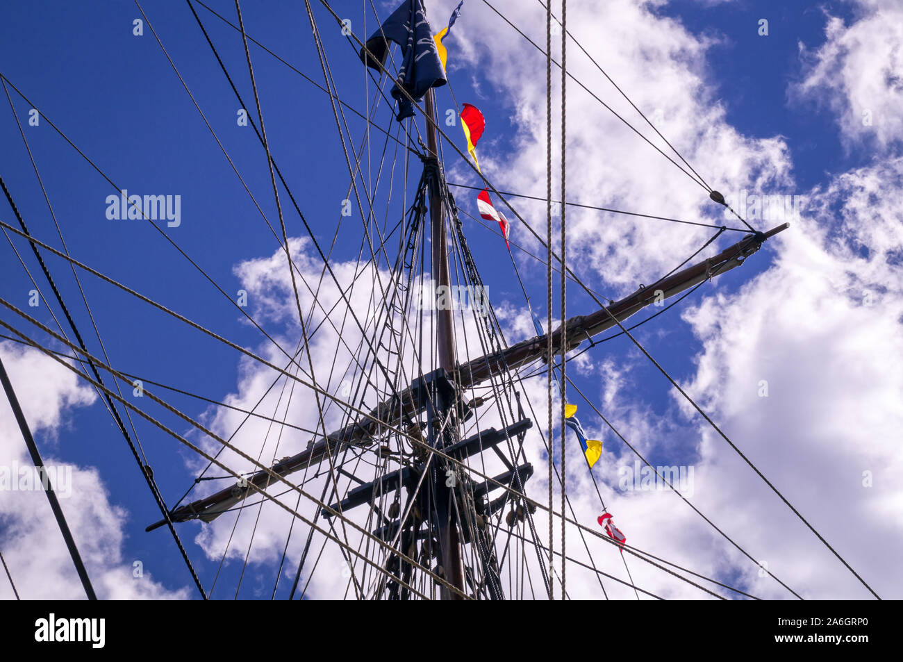 Mast, rigging and flags of a classic sailing ship Stock Photo - Alamy