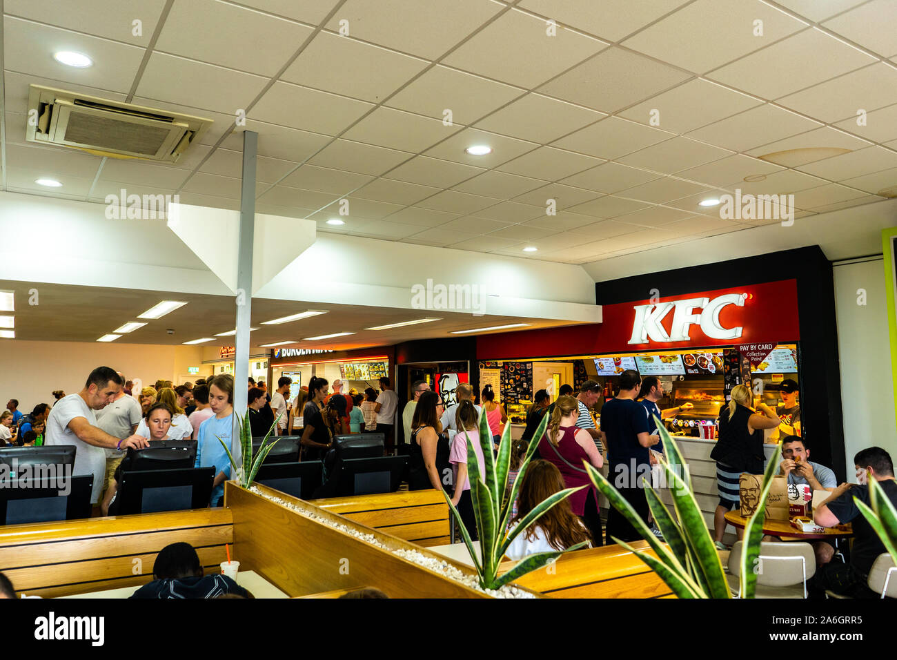 Customers queue at KFC & Burger King at the M5 motorway service station ...