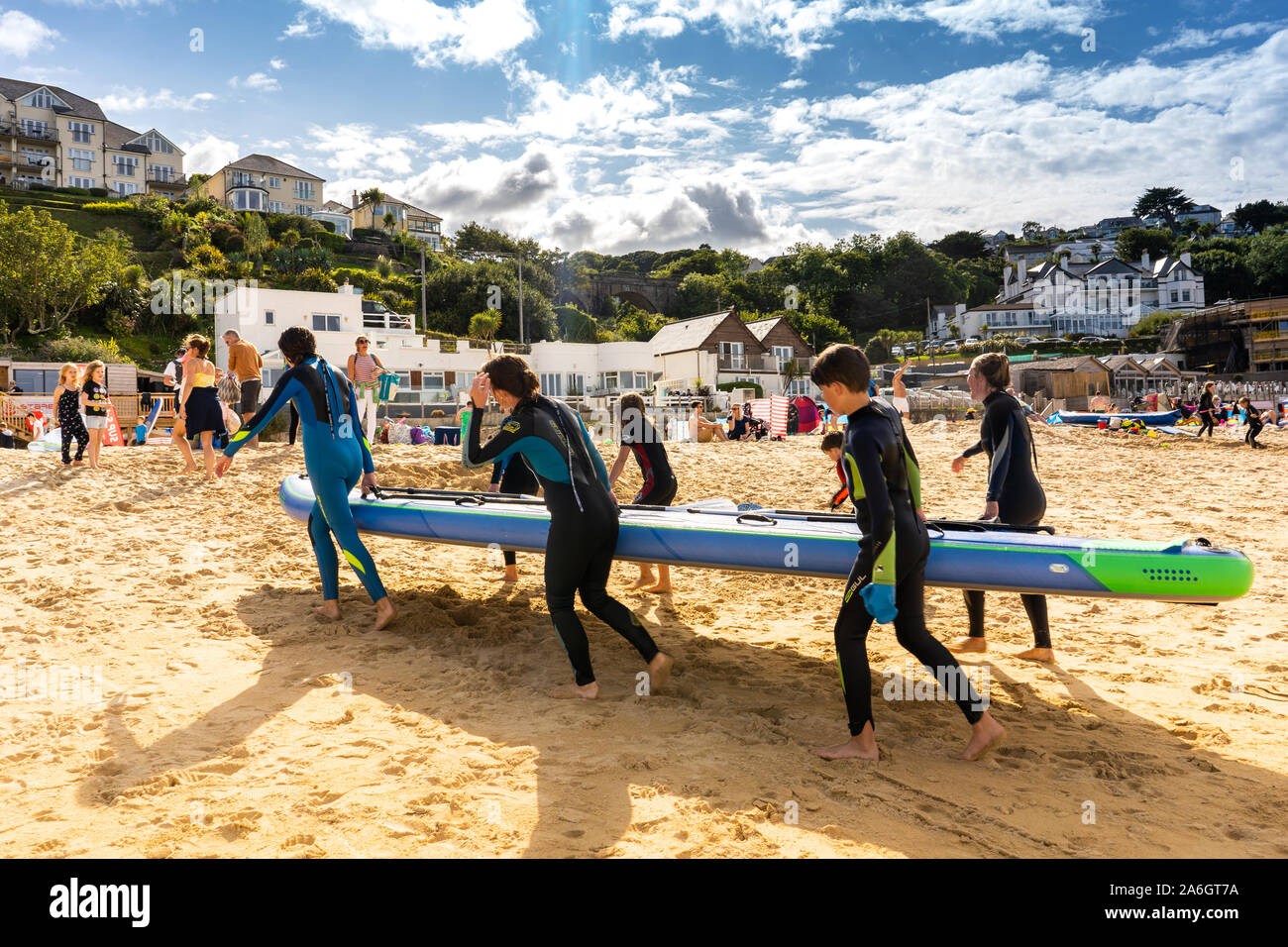 Beach goers sunbath, surf, kayak and enjoy family time at one of the ...