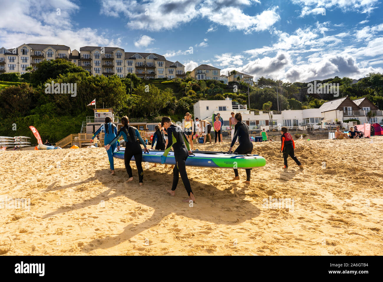 Beach goers sunbath, surf, kayak and enjoy family time at one of the ...