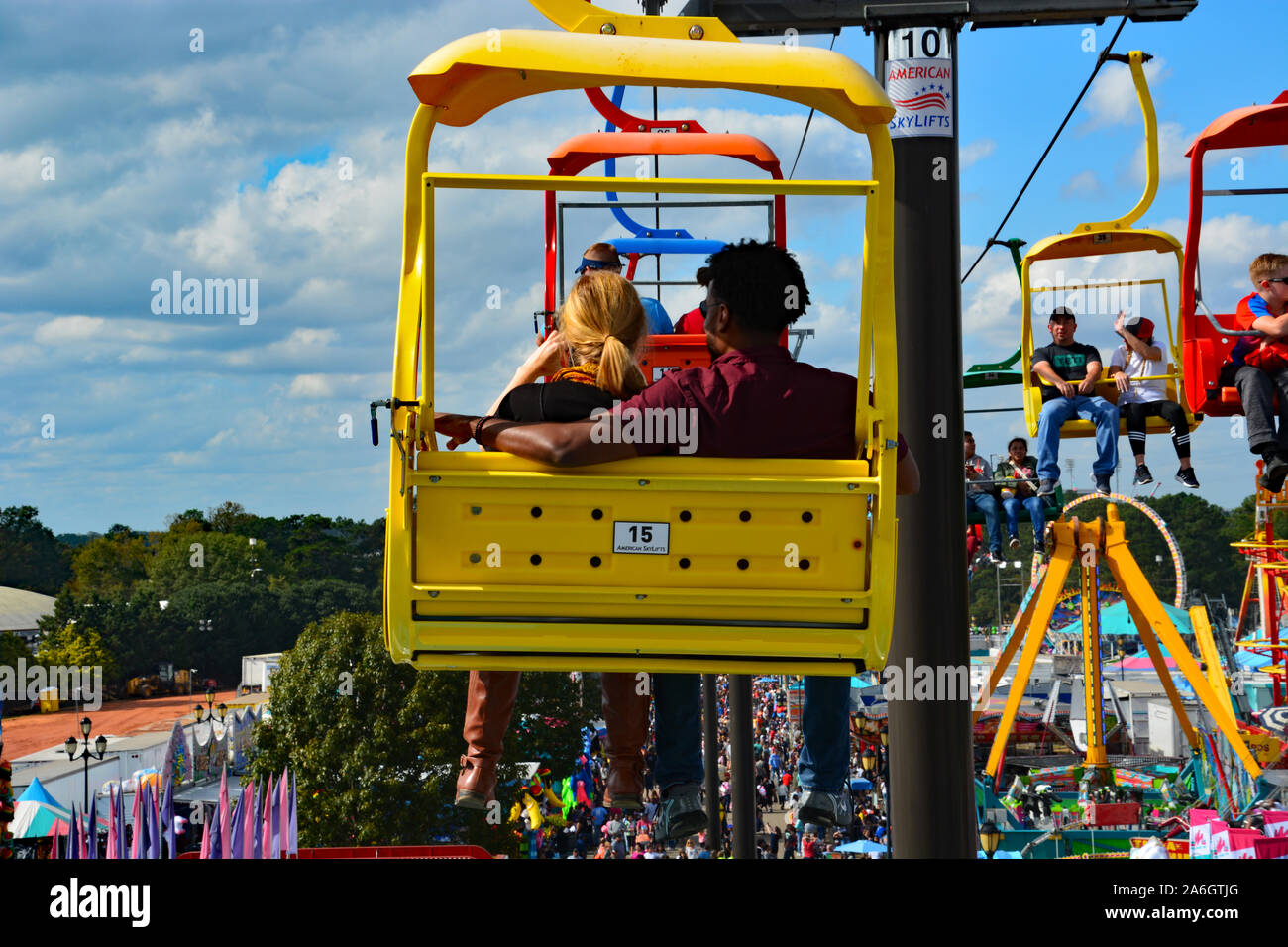 A young couple on a date ride the Flyer gondola ride at the North ...