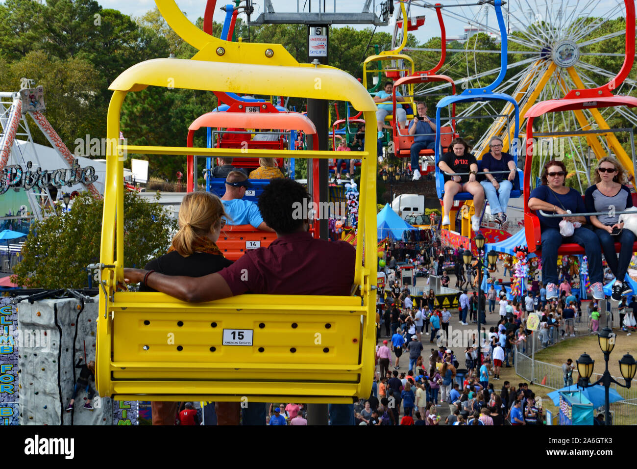 A young couple on a date ride the Flyer gondola ride at the North ...