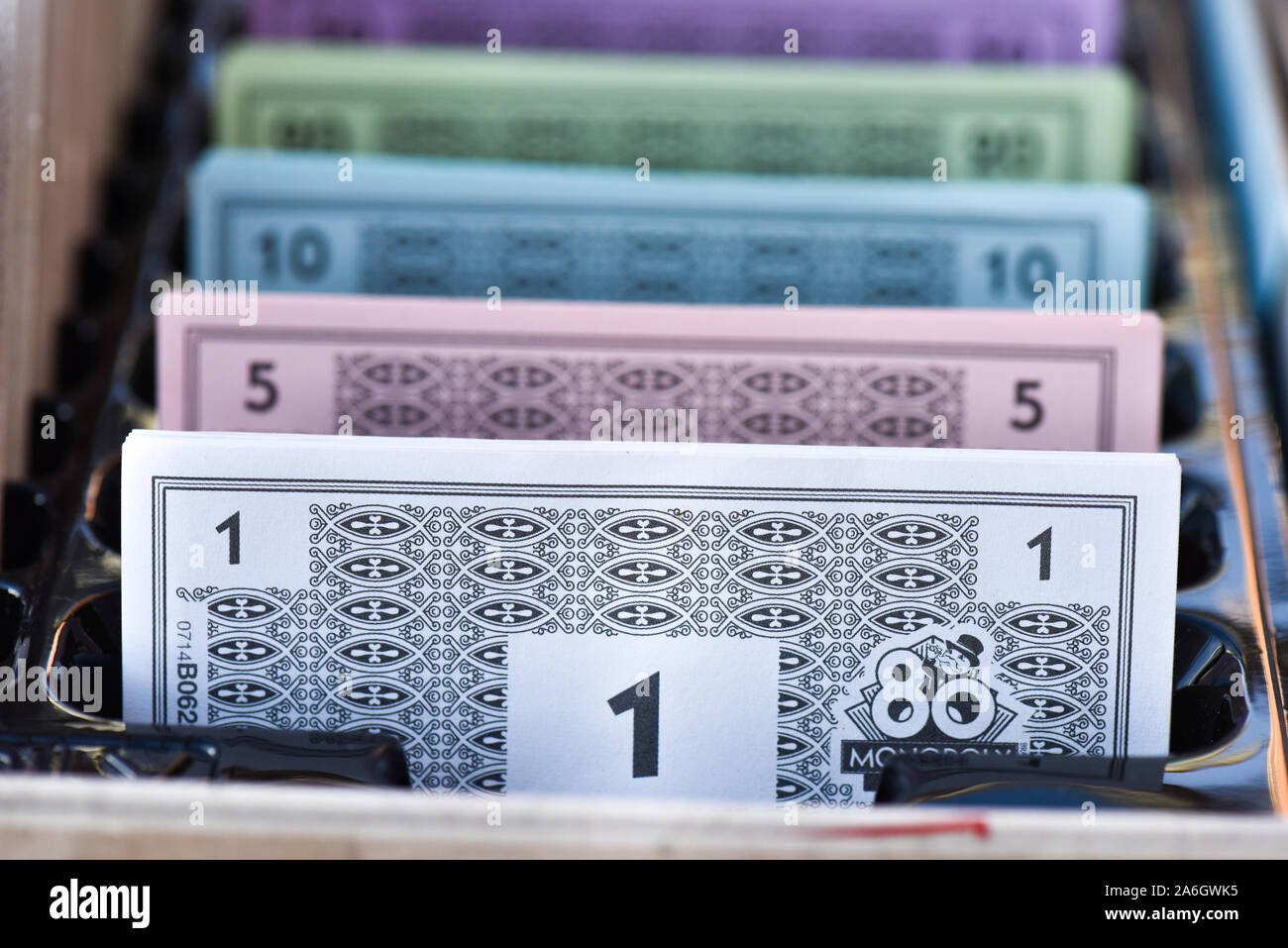 Monopoly board properties and money stacked neatly in the banking tray ...