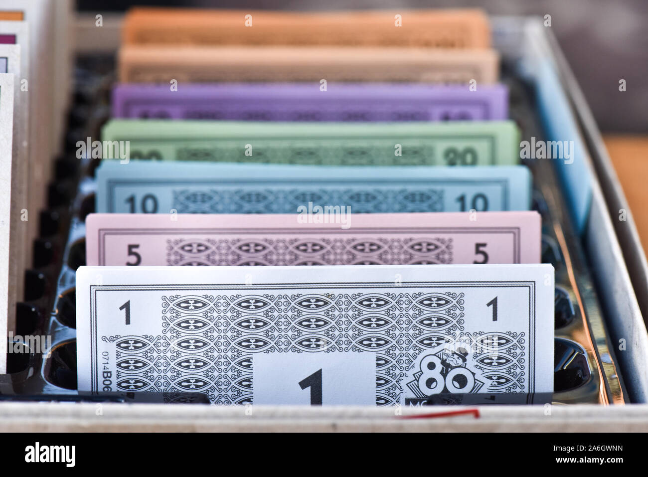 Monopoly board properties and money stacked neatly in the banking tray ...