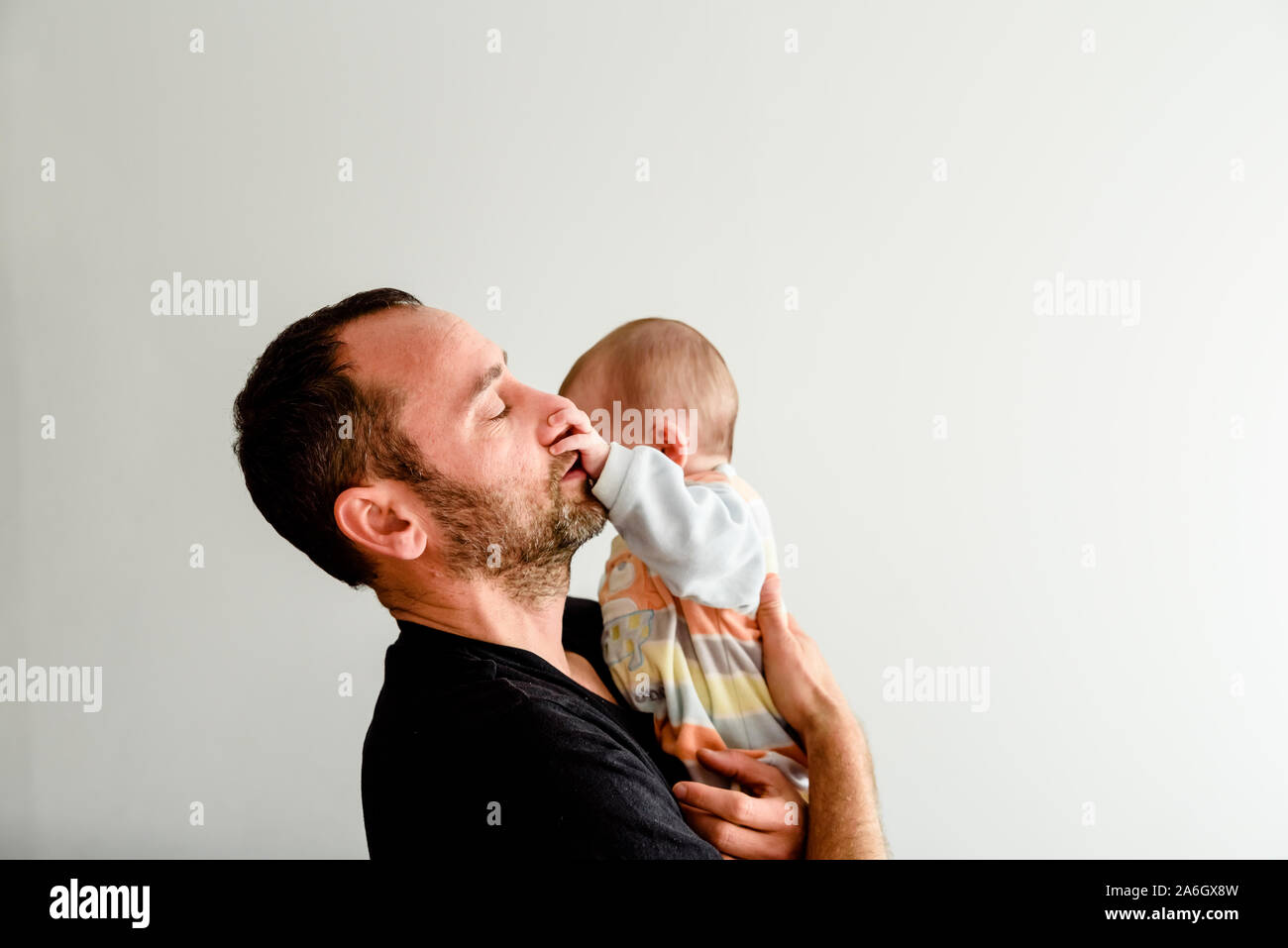 Baby Sleeping In Father Arms Stock Photos & Baby Sleeping In Father ...