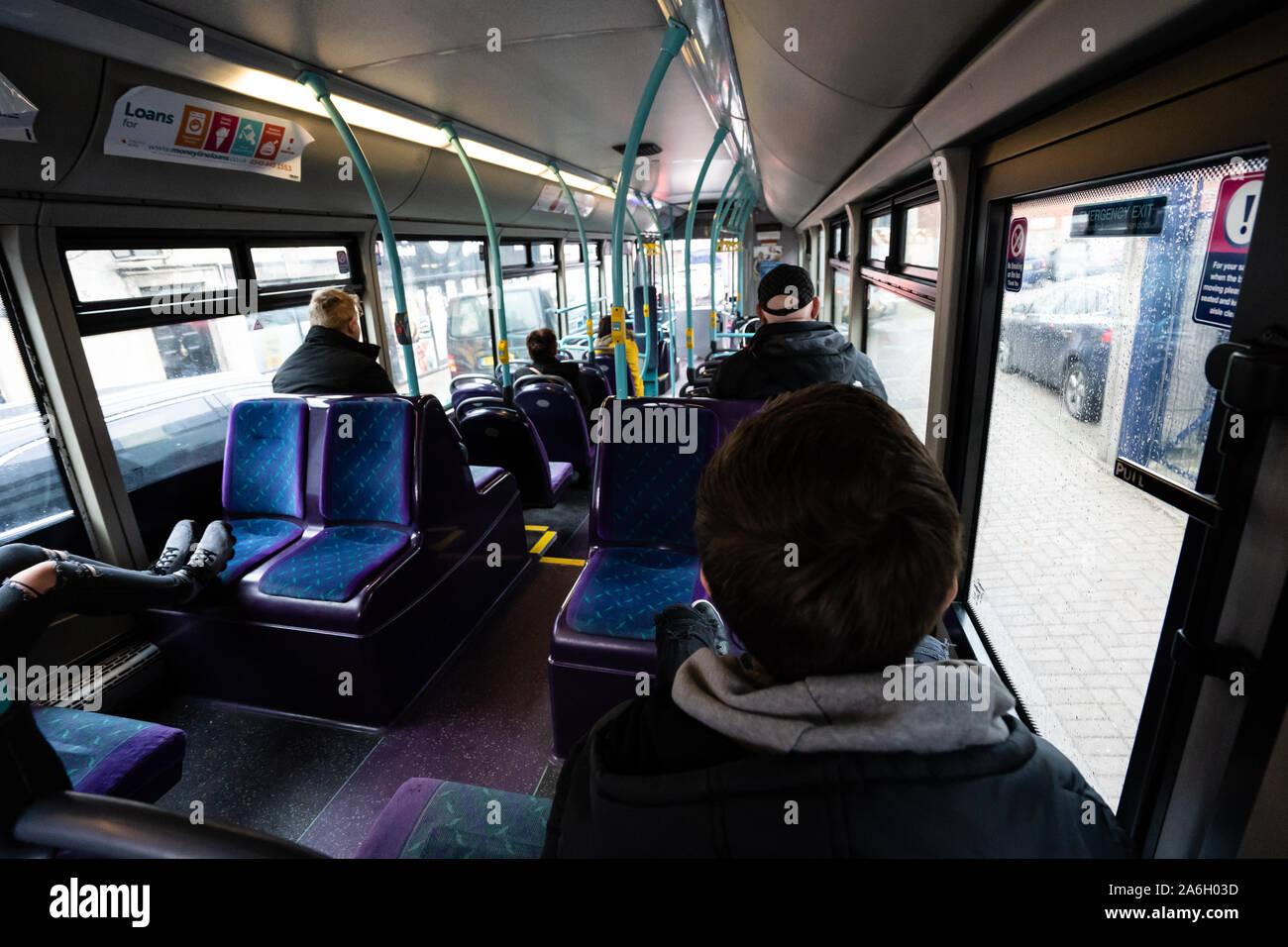 People seated on a bus at night time taking a journey from Longton to ...