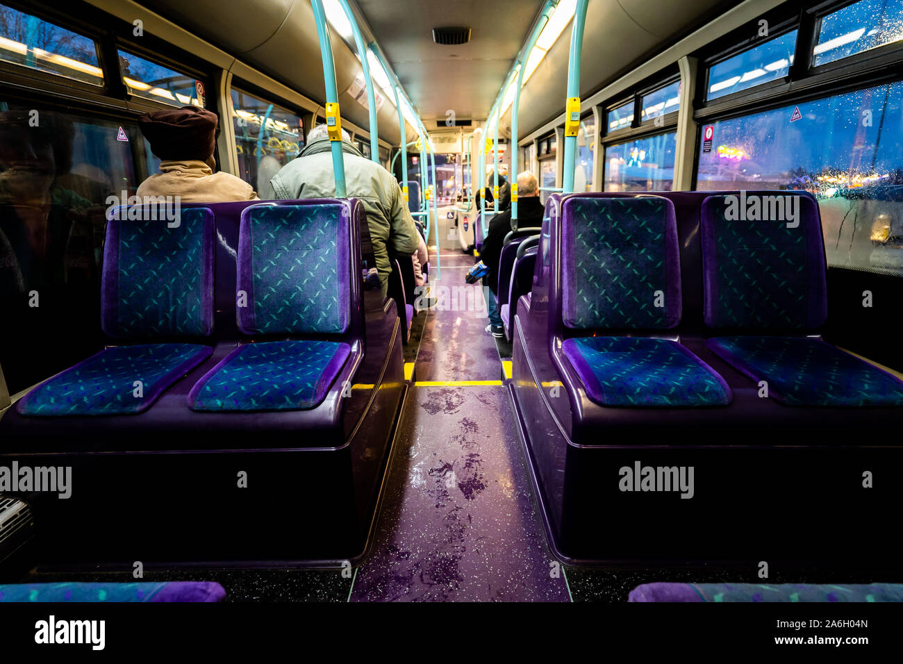 People seated on a bus at night time taking a journey from Longton to ...