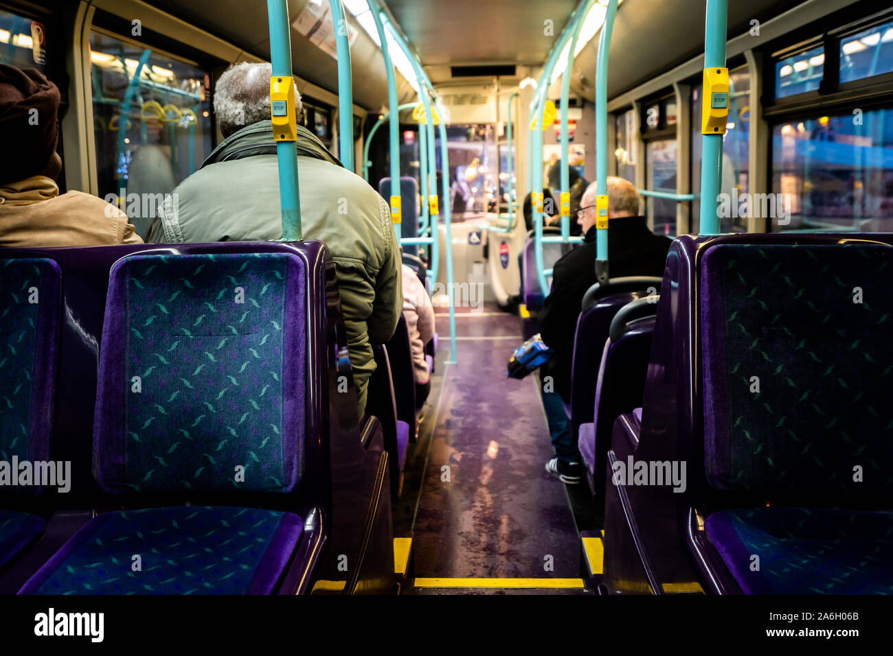 People seated on a bus at night time taking a journey from Longton to ...