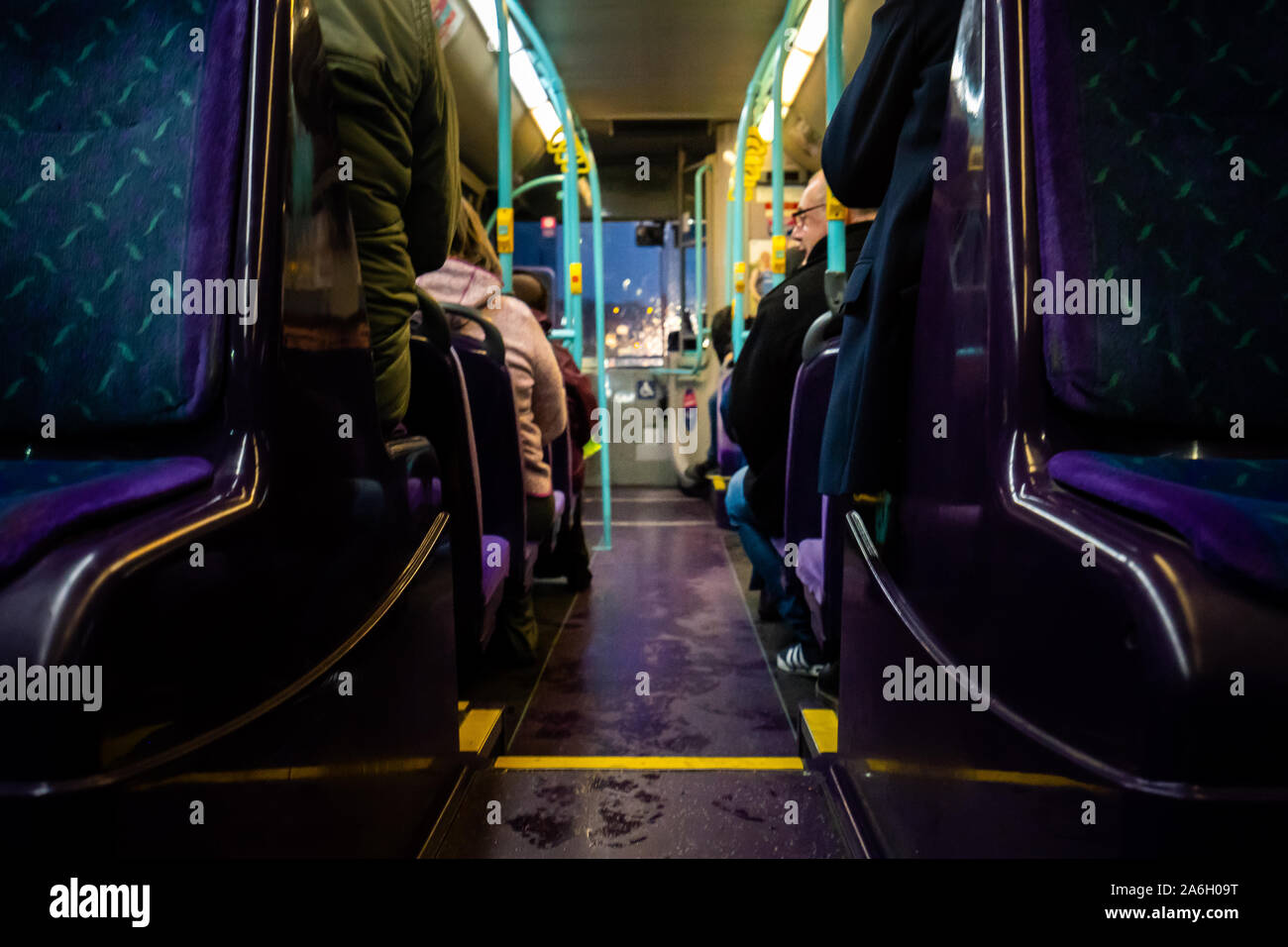People seated on a bus at night time taking a journey from Longton to ...