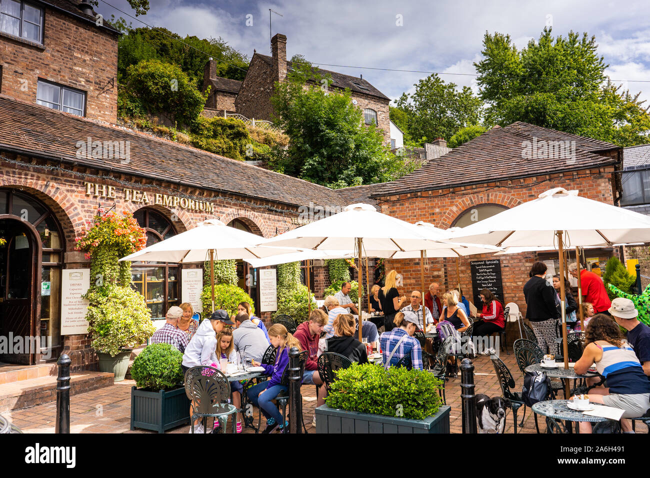 Customers enjoy a refreshment and food at the Emporium cafe in ...