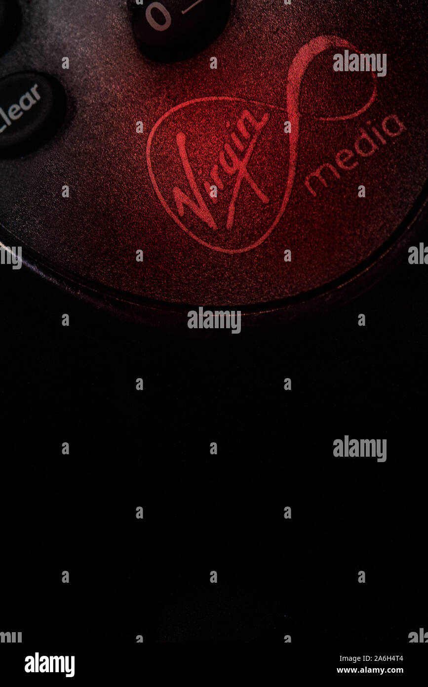 Virgin media television control close up, isolated on a mirrored ...