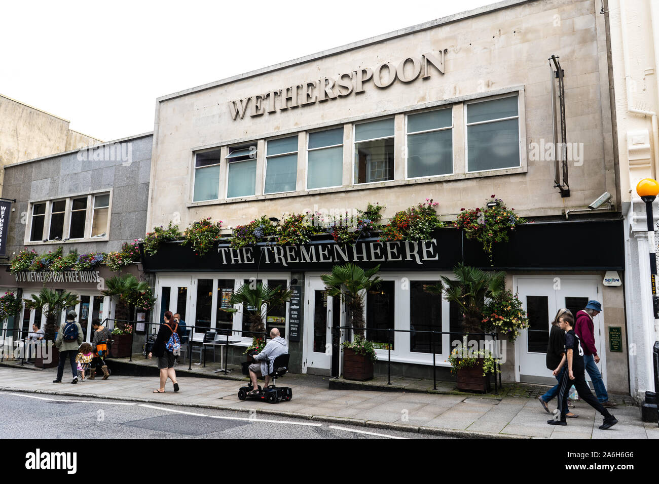 People walking by and entering the Tremenheere JD Wetherspoons pub in ...